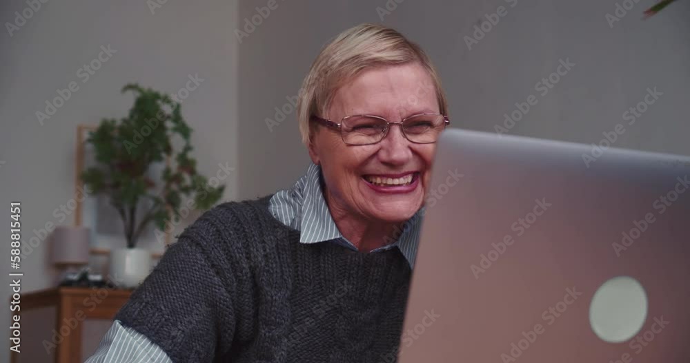 Close-up happy cheerful senior granny woman laughs and smiles talking ...