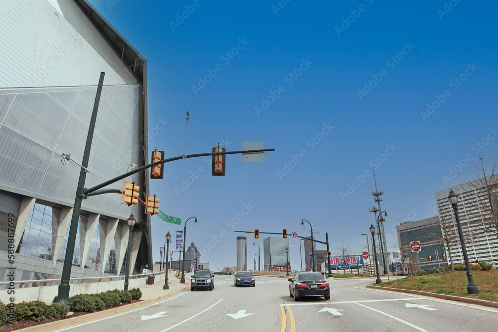 Downtown Atlanta city street with traffic and the city skyline in view ...