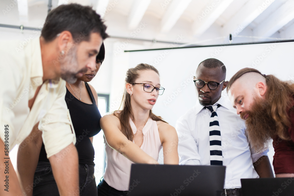 Multiracial business people working together at boardroom table at ...