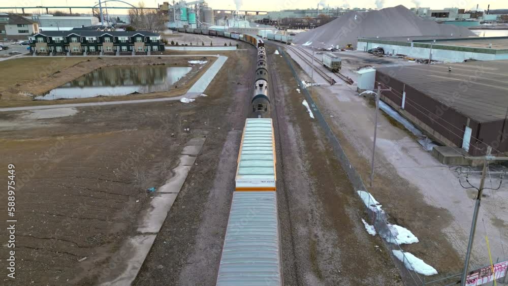 Railroad freight train rolling into industrial zone, rail yard, heavy ...