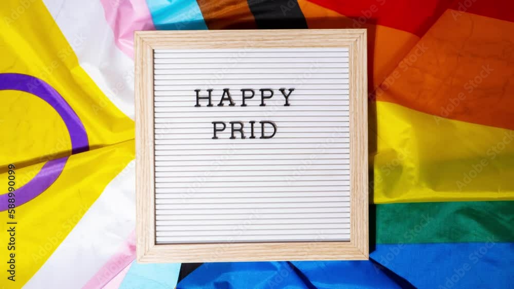 Stop motion HAPPY PRIDE MONTH frame on Rainbow LGBTQIA flag made from ...