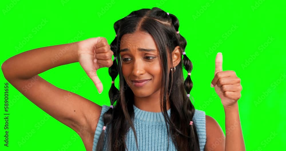 Thumbs up, down and face smile of woman on green screen in studio ...