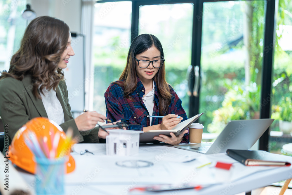Concept of engineering consulting, Two female engineers discussing ...