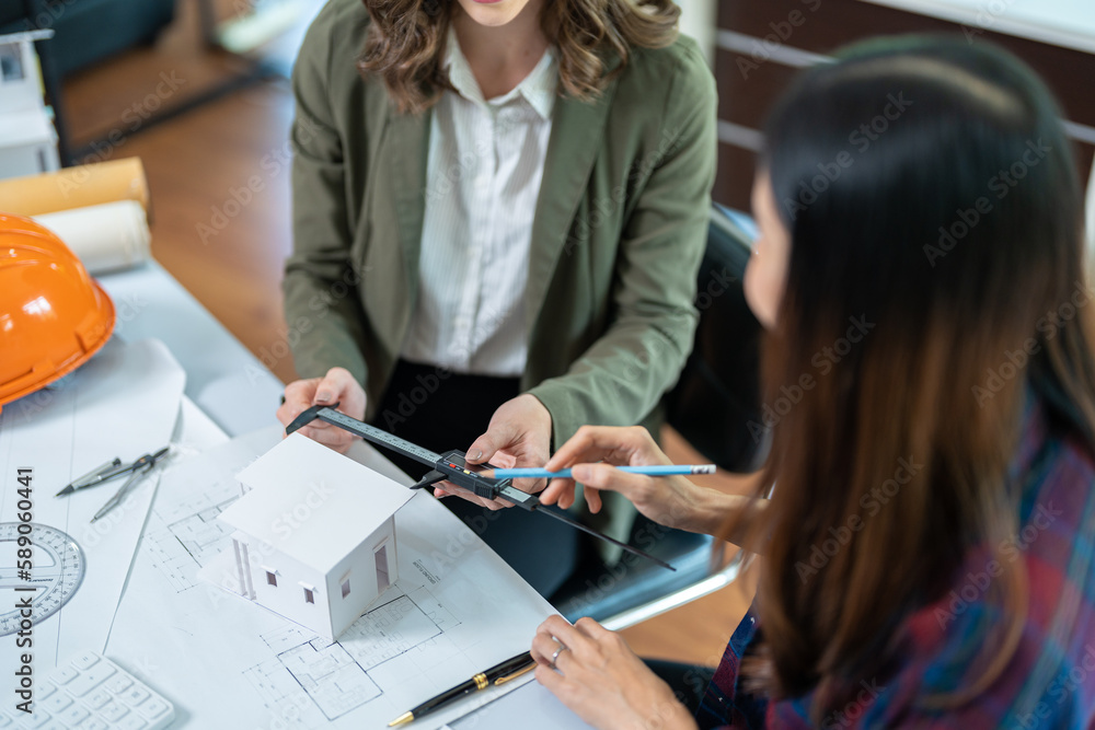 Concept of engineering consulting, Two female engineers discussing ...