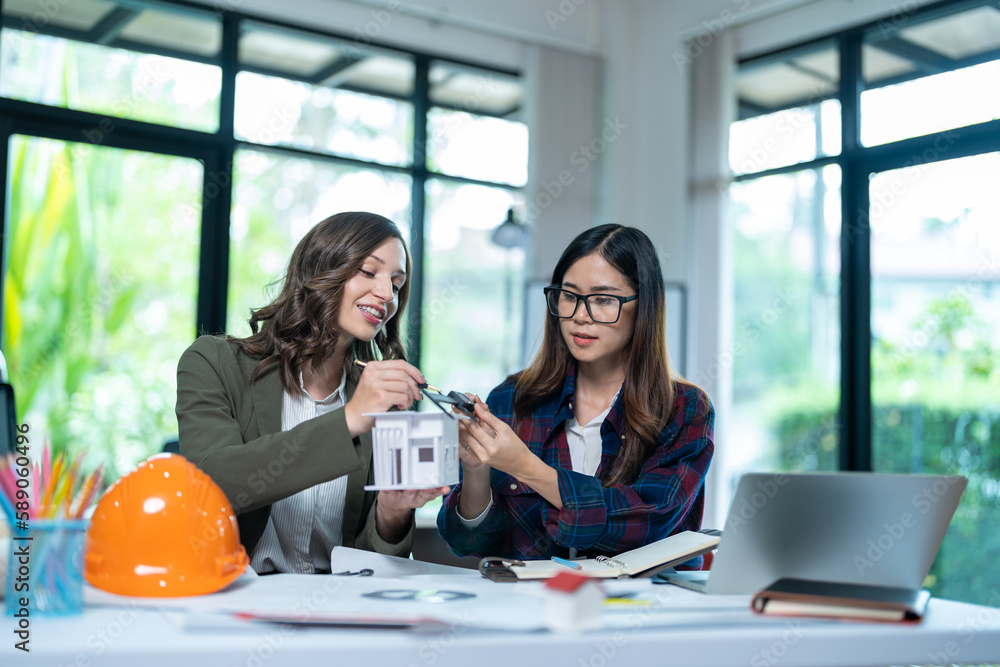 Concept of engineering consulting, Two female engineers discussing ...