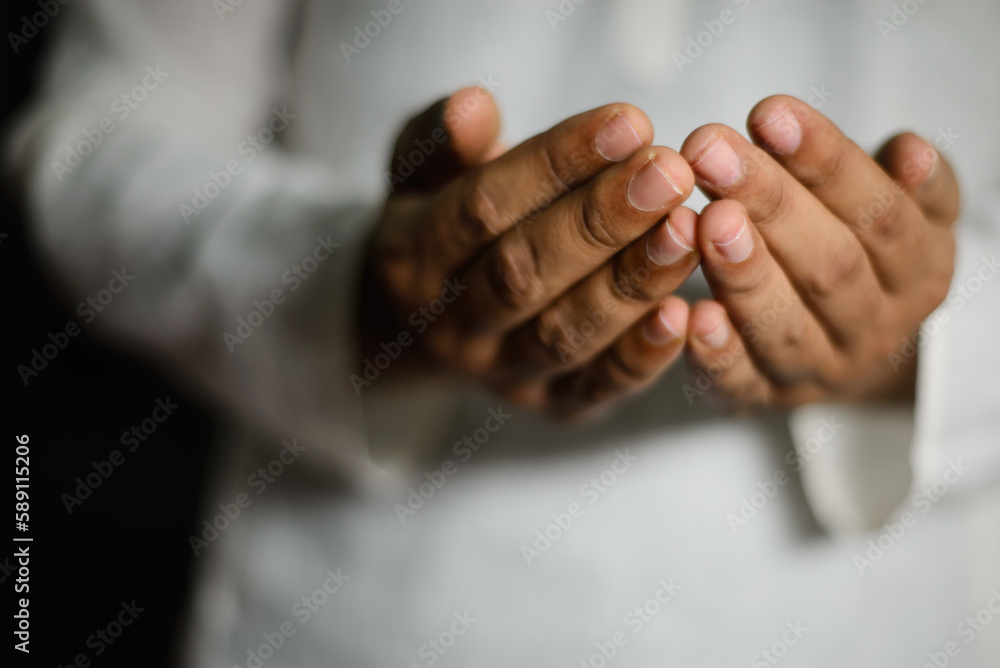 Muslim Person making dua rising hands, Reciting Quran, holding the ...