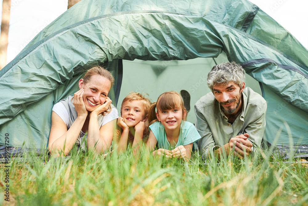 Happy family in tent camping in nature in summer Stock Photo | Adobe Stock