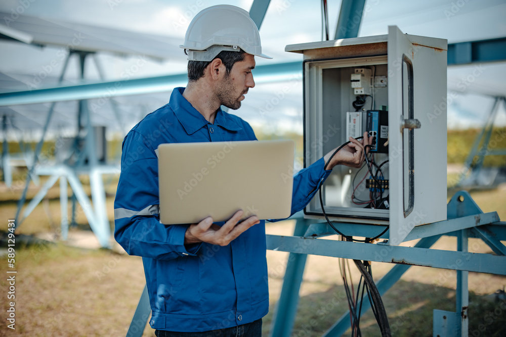 Solar electric installer and practitioner inspect electrical systems ...