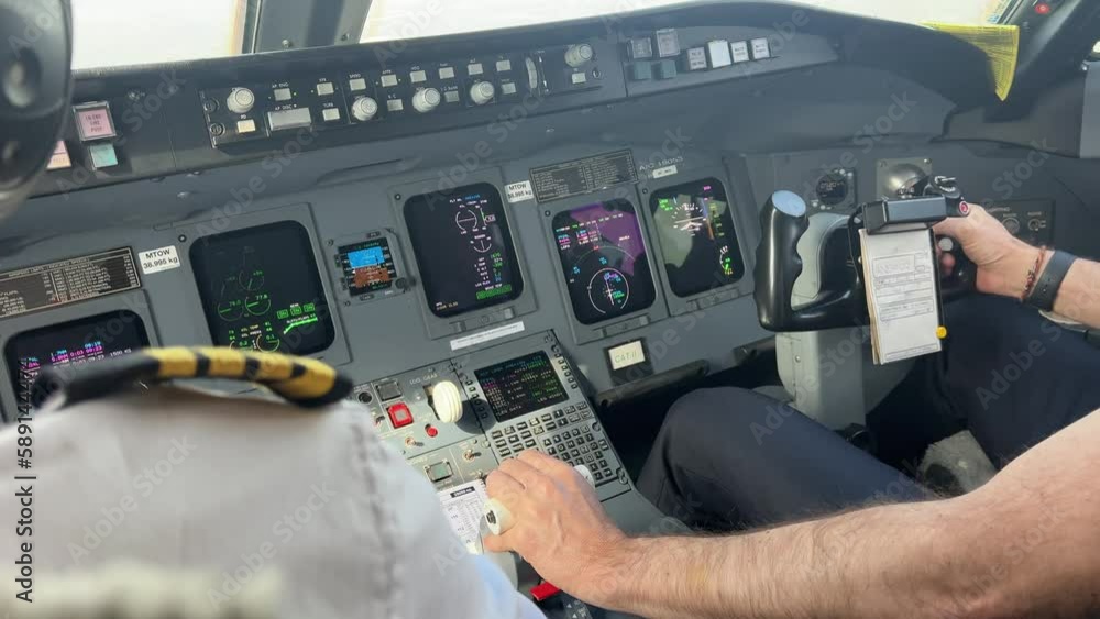 A jet cockpit’s view during a real flight. POV. Copilot is flying the ...
