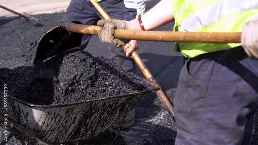 Road Workers Shoveling Hot Tarmac. Road Construction Works. Men Working ...