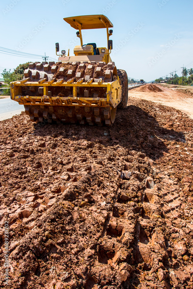 The soil compactor is in the work area.Road roller equipped with ...