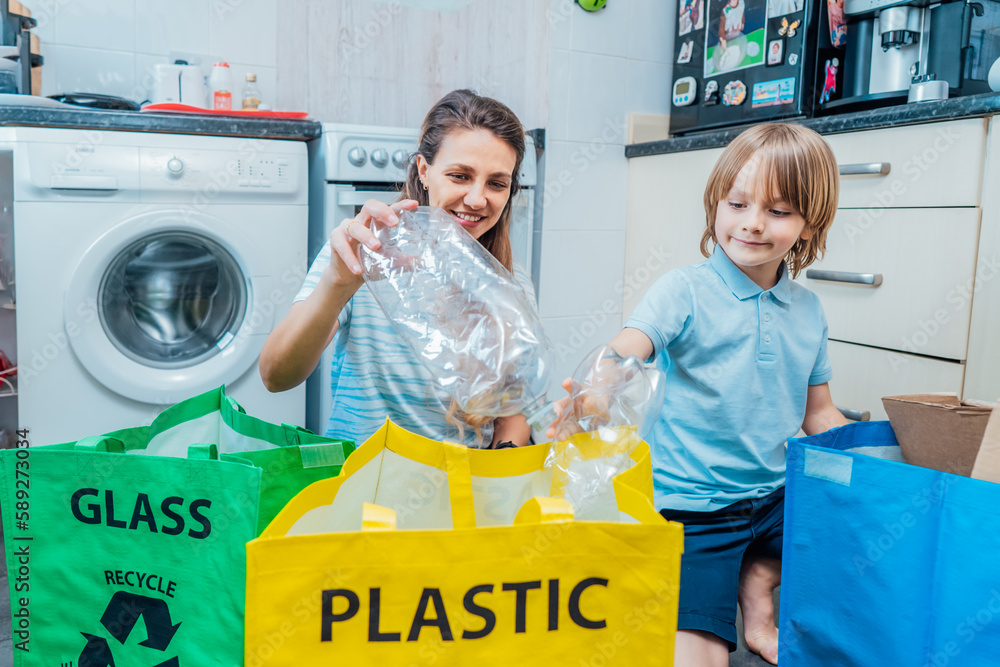 Mother is teaching kid how to recycle help the boy aware environmental ...