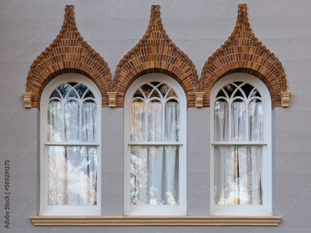 Pretty Venetian Renaissance style windows with red brick detail in side ...