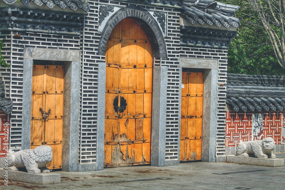beautiful brick arch with wooden gates ancient Chinese style. with ...