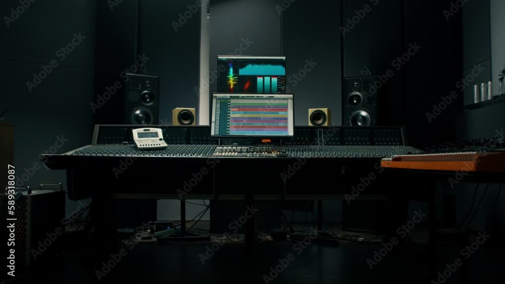 recording studio with a screen with sound wave and volume settings two ...
