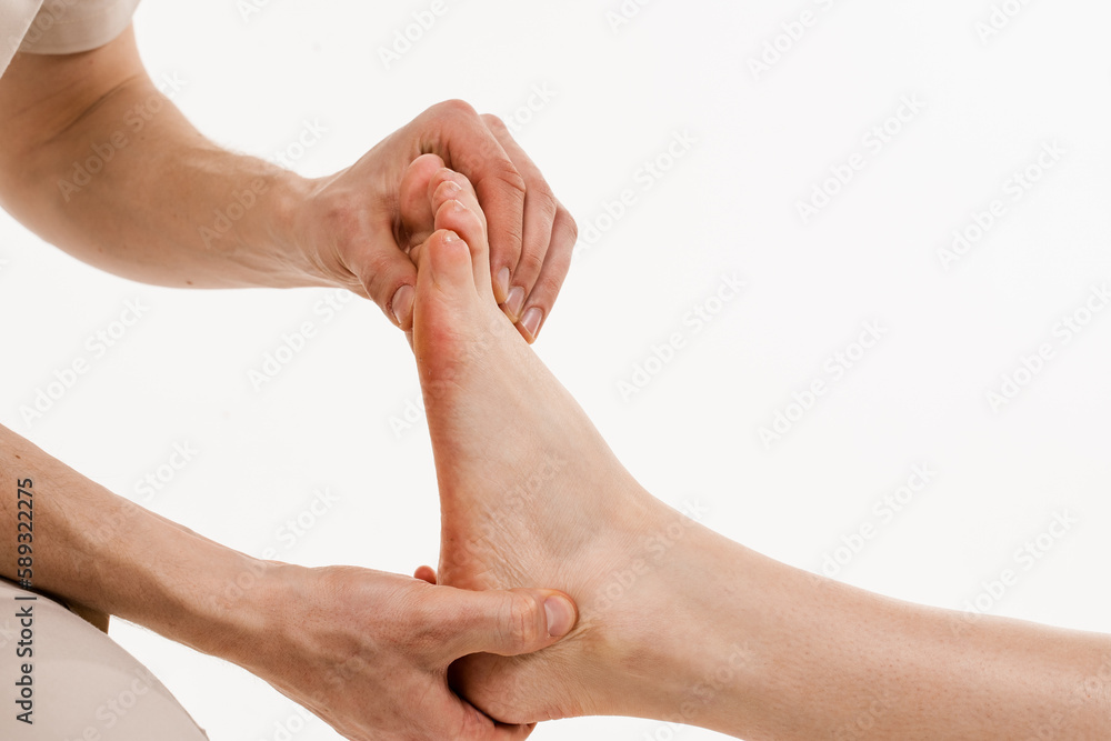 Foot close-up. Orthopedist is touching and pressing foot for assessment ...