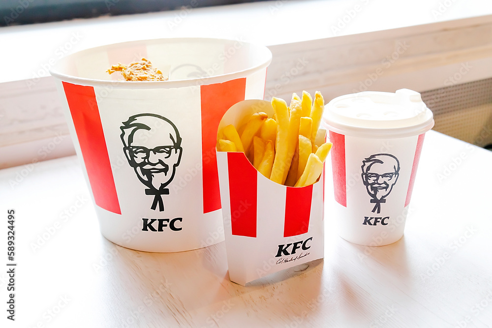 Bucket,chicken nuggets,wings,legs,Fries,coffee menu on tray in KFC ...