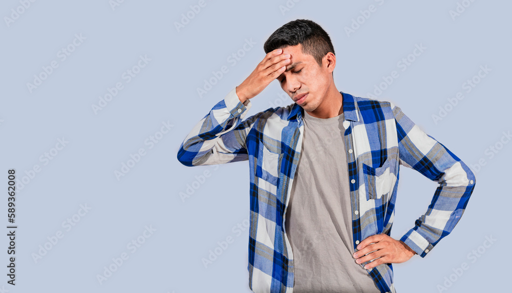 Worried young man holding his forehead, Worried man isolated, tired man ...
