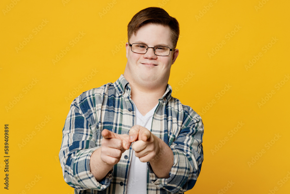 Young smiling man with down syndrome wearing glasses casual clothes ...