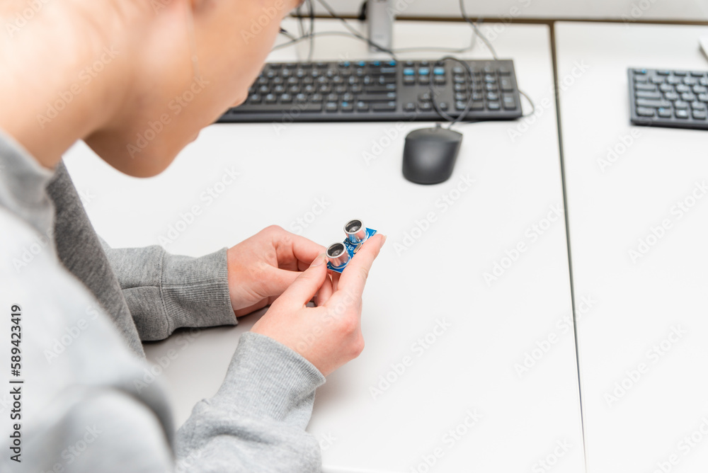 Student girl Learning To Program Robot Ultrasonic distance sensors ...