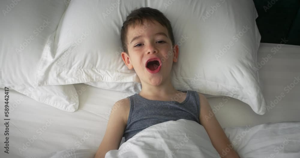 Portrait of a happy Cute funny cheerful little child boy in pajamas ...