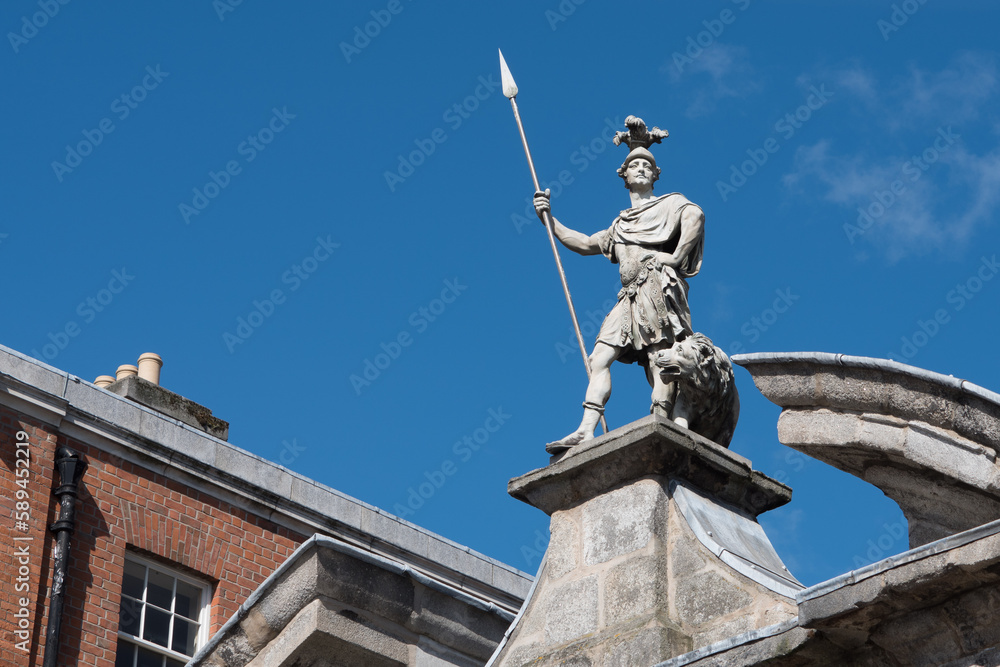 Statue of Fortitude with spear and lion on the gate of Dublin castle in ...