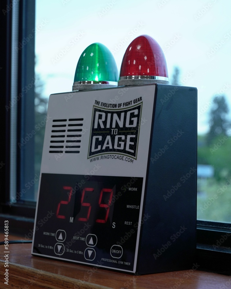 Vertical closeup of an electronic boxing bell with a countdown timer on ...