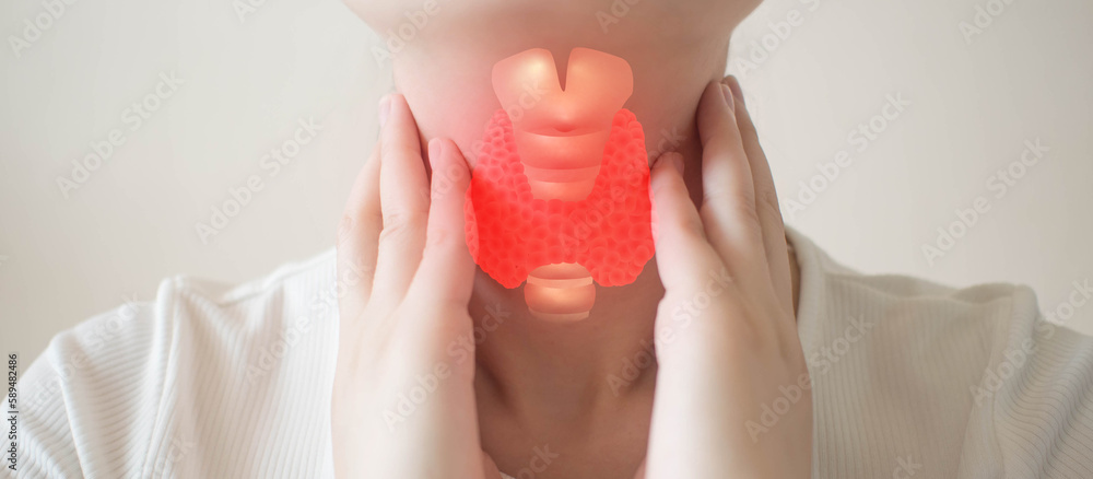 Female checking thyroid gland by herself. Close up of woman touching ...