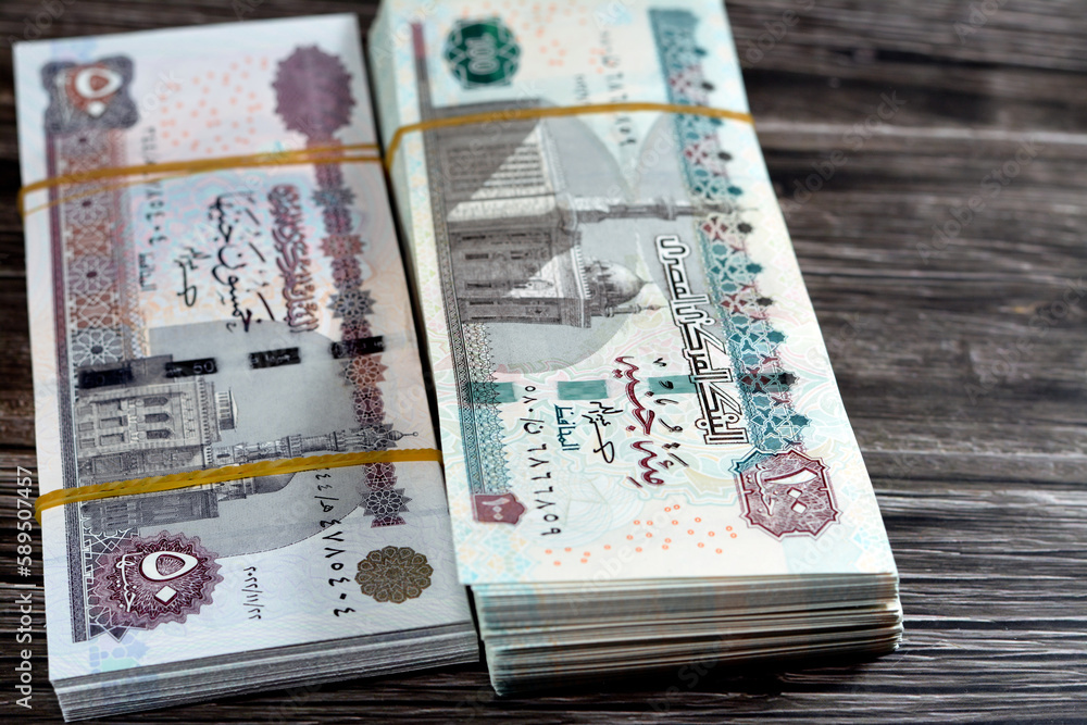 Stacks of Egypt money banknote bills of 100 and 50 EGP LE one hundred ...