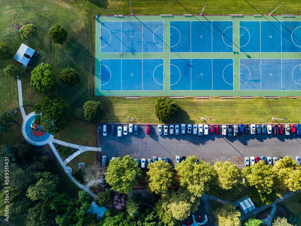 Full carpark at rose point park beside netball courts for morning ...