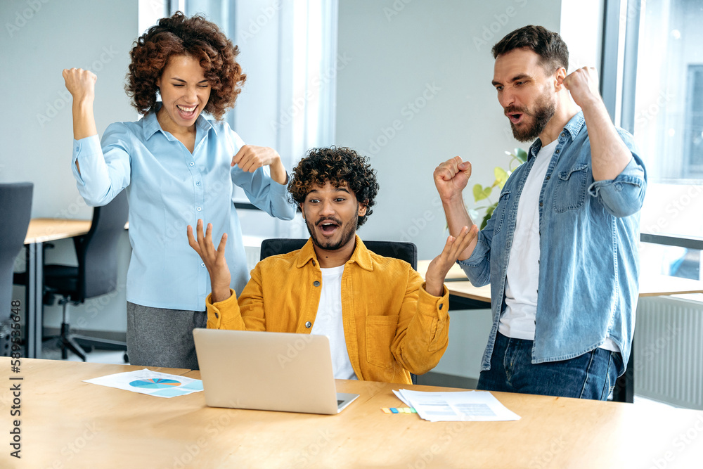 Joyful people of different nationalities, creative business team ...