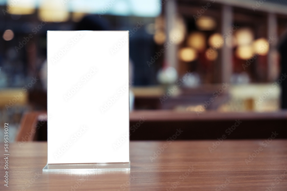 Menu frame standing on wood table in Bar restaurant cafe. space for ...