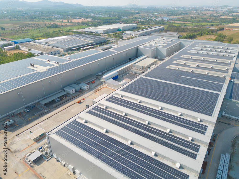 Aerial view of solar panels or solar cells on the roof of factory ...