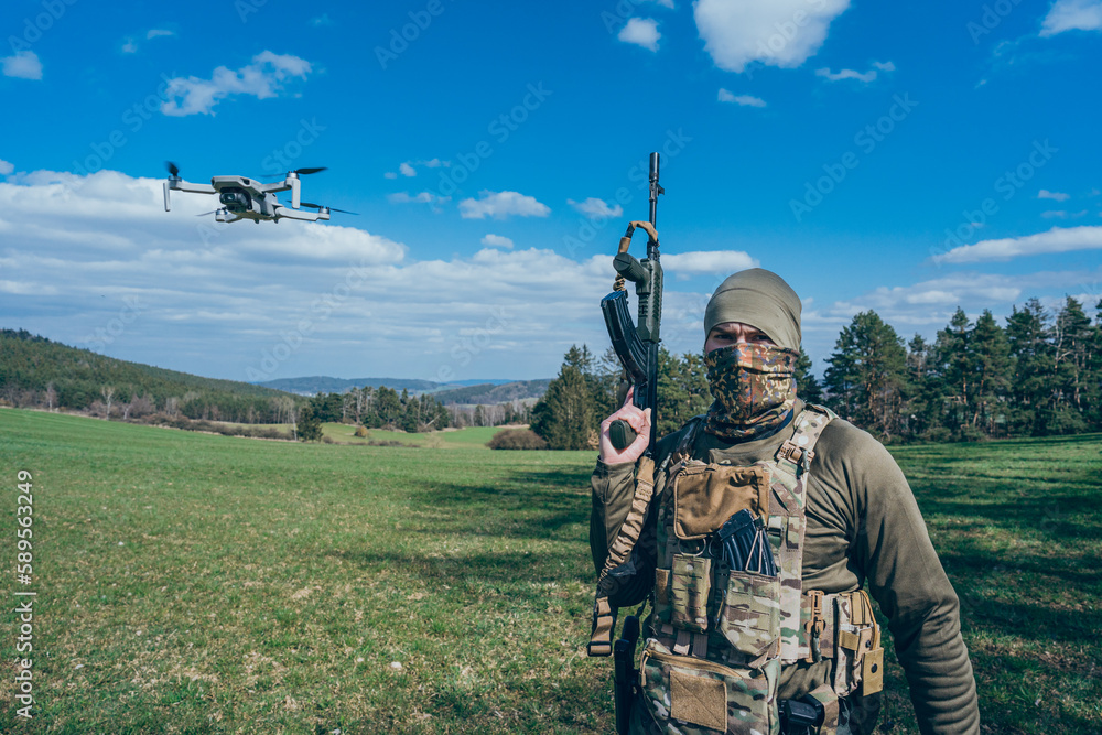 Modern army soldiers using aerial drone for artillery guidance and ...