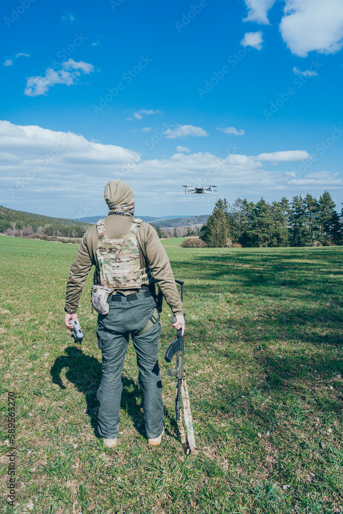 Modern army soldiers using aerial drone for artillery guidance and ...