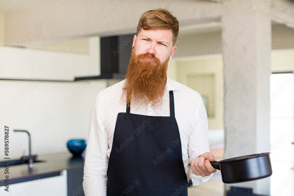 red hair man feeling sad and whiney with an unhappy look and crying in ...