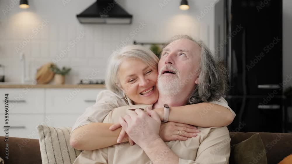 portraits of a married elderly couple hugging each other showing love ...