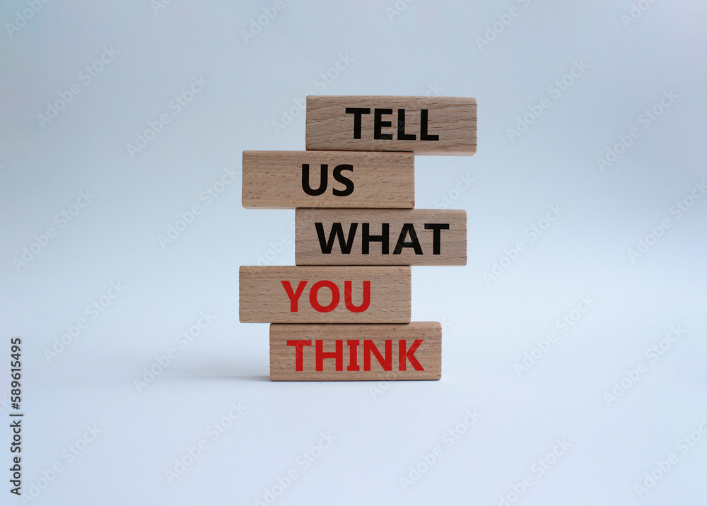 Tell us what you think symbol. Wooden blocks with words Tell us what ...
