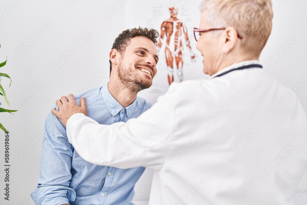 Mother and son patient and doctor having medical consultation at clinic ...
