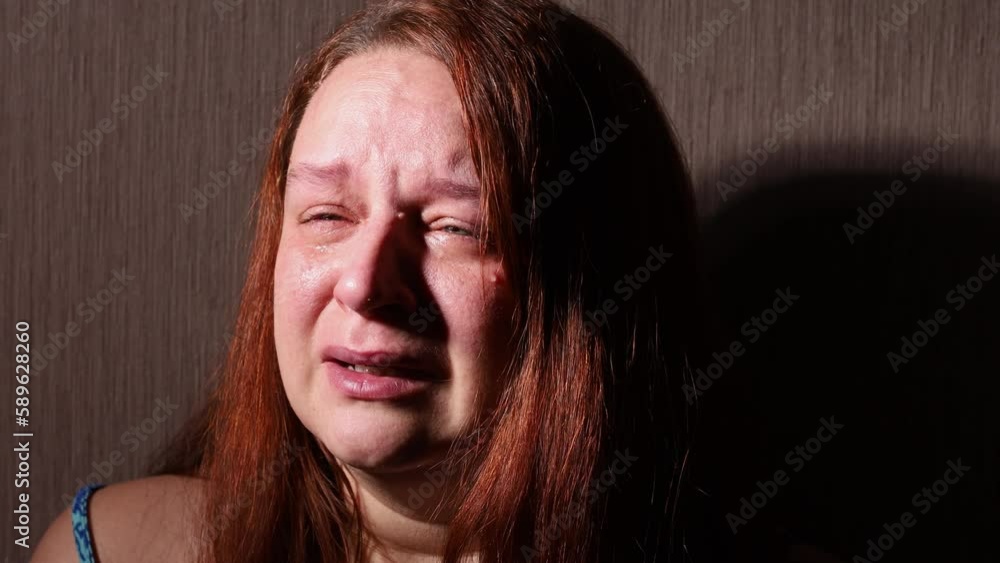Upset woman bitterly cry in dark room closeup. Tears rolling down ...