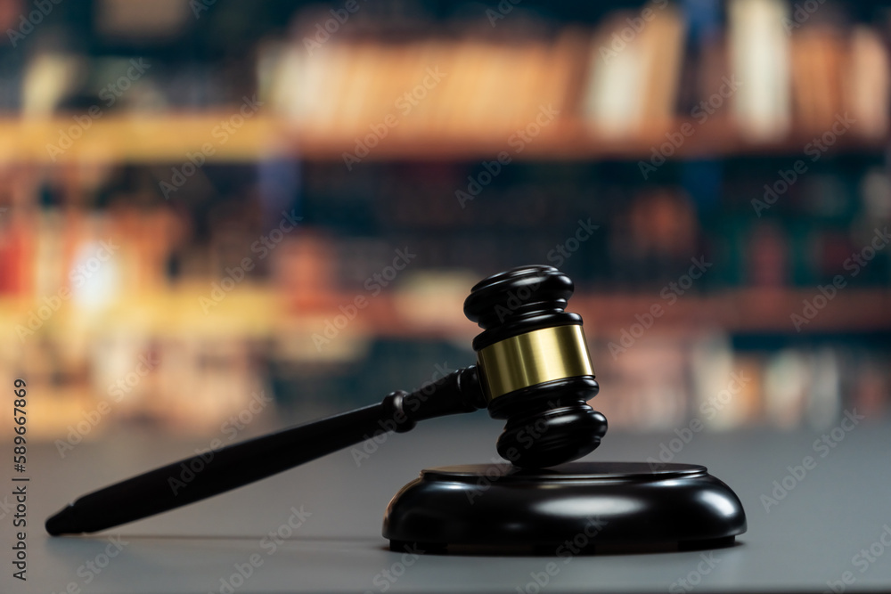 Black wooden gavel hammer on law firm or lawyer office background as ...