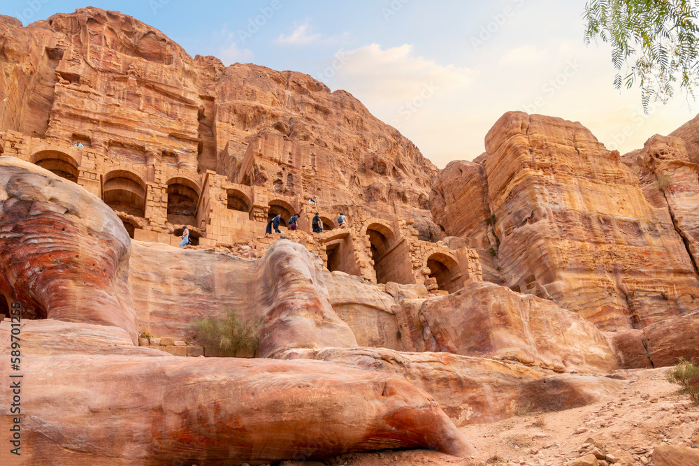 Visitors climb the stairs towards the Urn Tomb, an Ancient burial ...