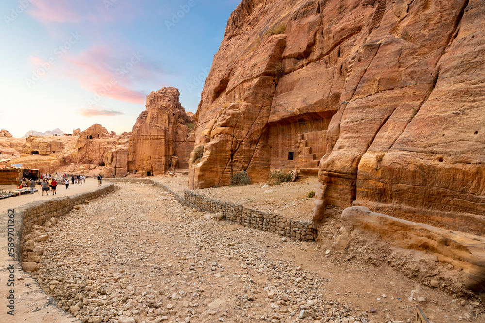 Tourists and visitors walk the canyon path through the Street of ...