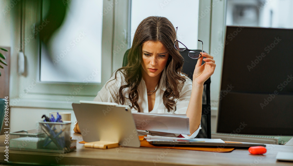 Young intern is having difficulties with her new assignment, she looks ...