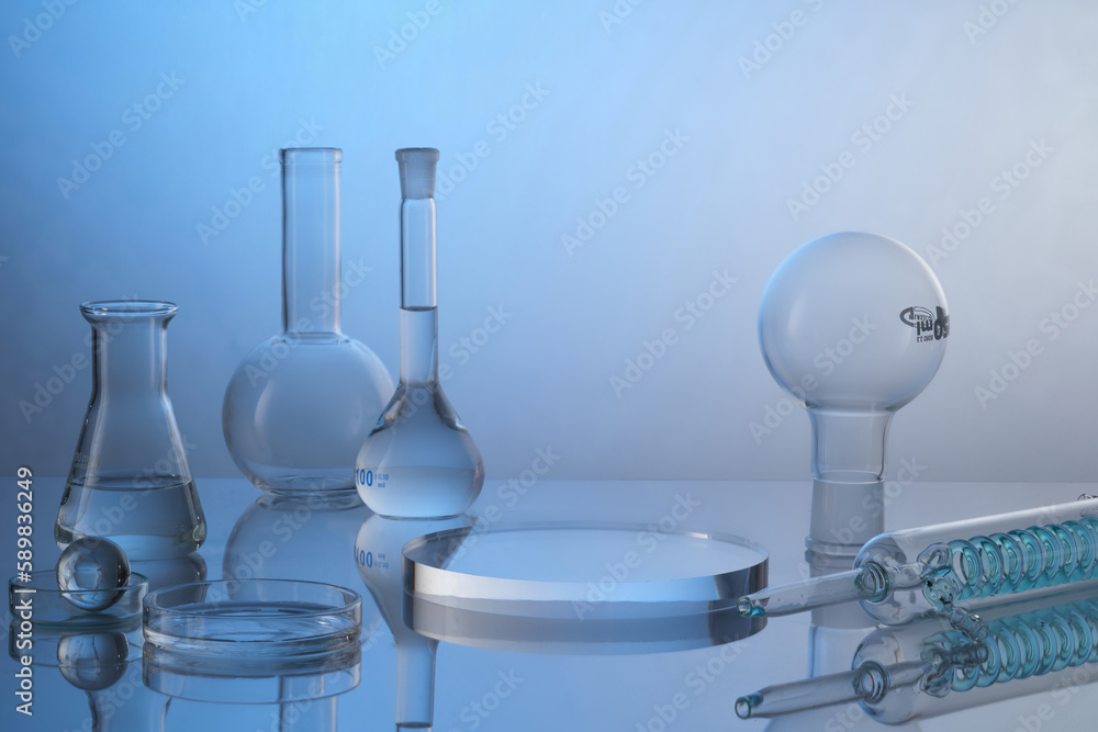 Laboratory glass equipment with transparent water ingredients on color ...