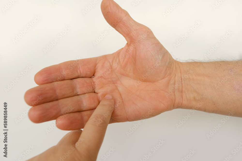 closeup of male hand of adult mature man in gesture fingers holding ...
