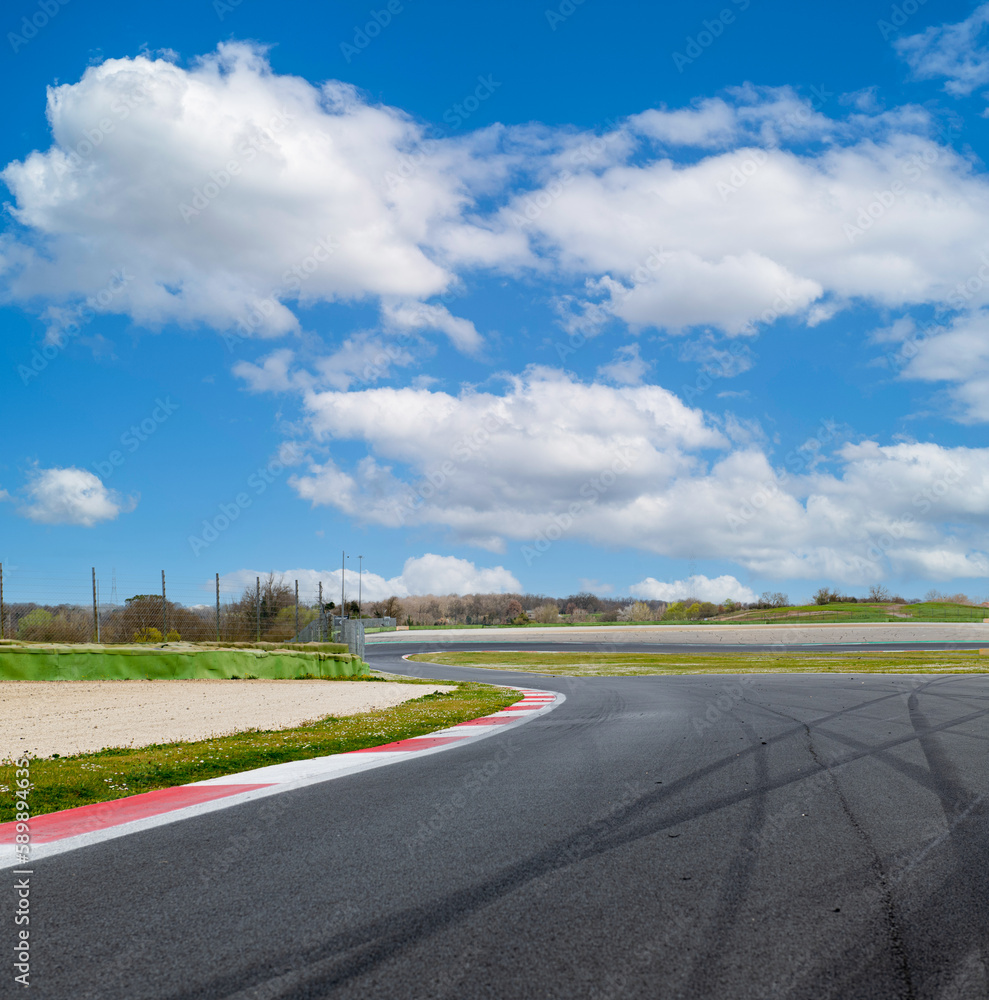 Motor sport asphalt race track and curbs with skid marks, low angle ...