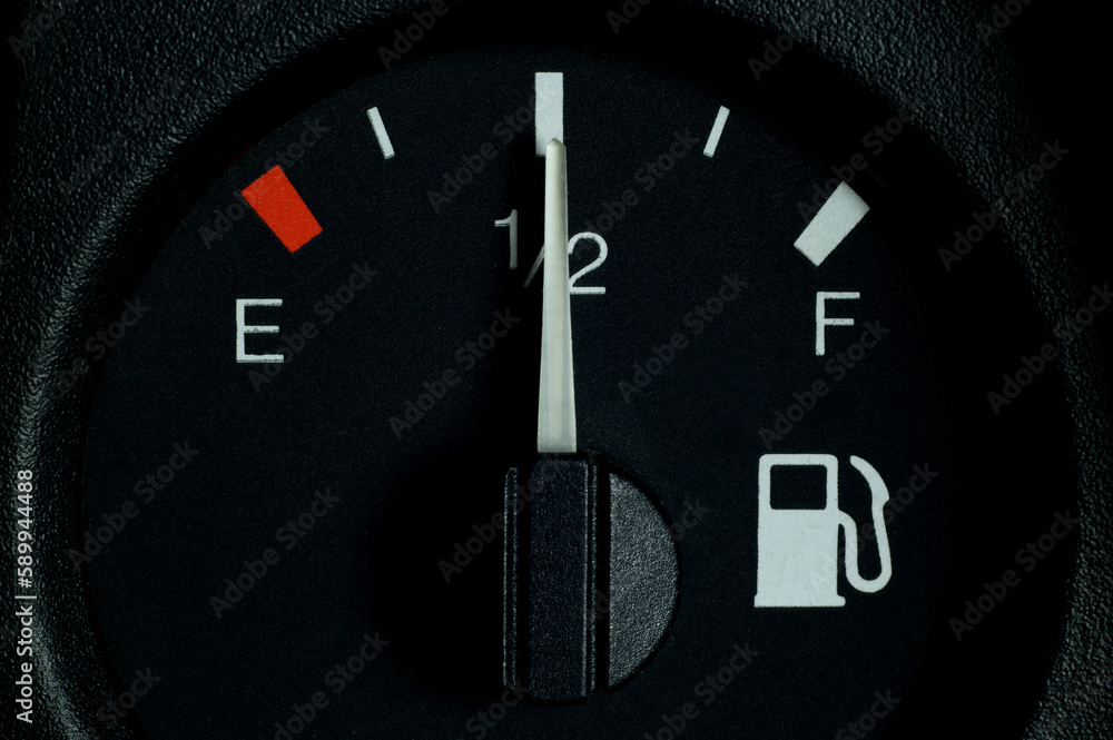 The indicator on the car panel, half of the fuel tank. Close-up. Fuel ...