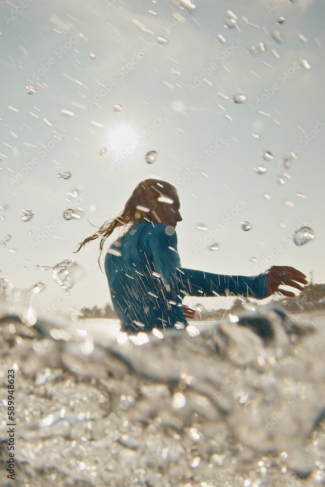 Woman surfer rides the wave. Woman surfs the ocean wave in the Maldives ...