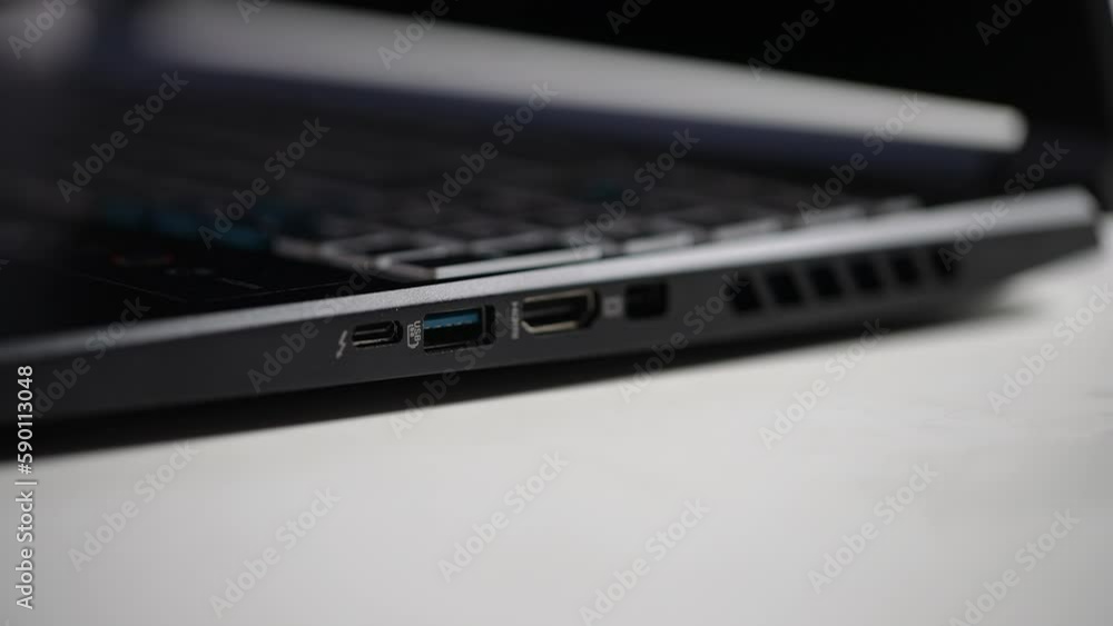 Detail cropped shot of unrecognizable man inserting USB cable into ...